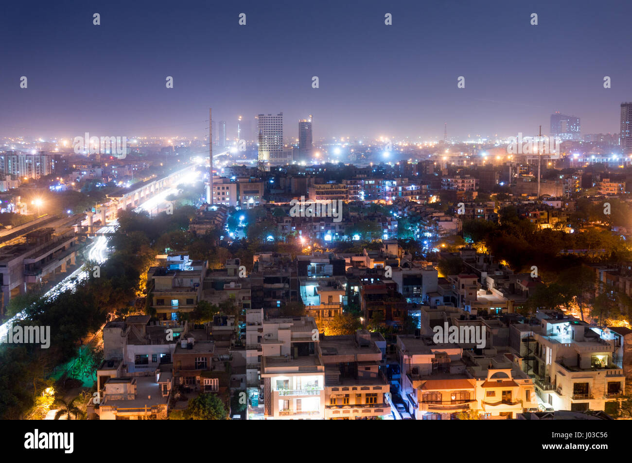 Noida cityscape at night with houses, office, skyscrapers, streets and ...