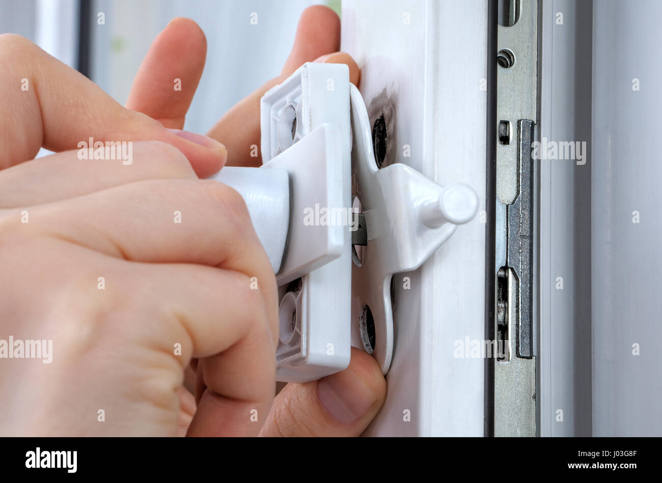Installer hands close-up, installation of limiter pvc window Stock ...