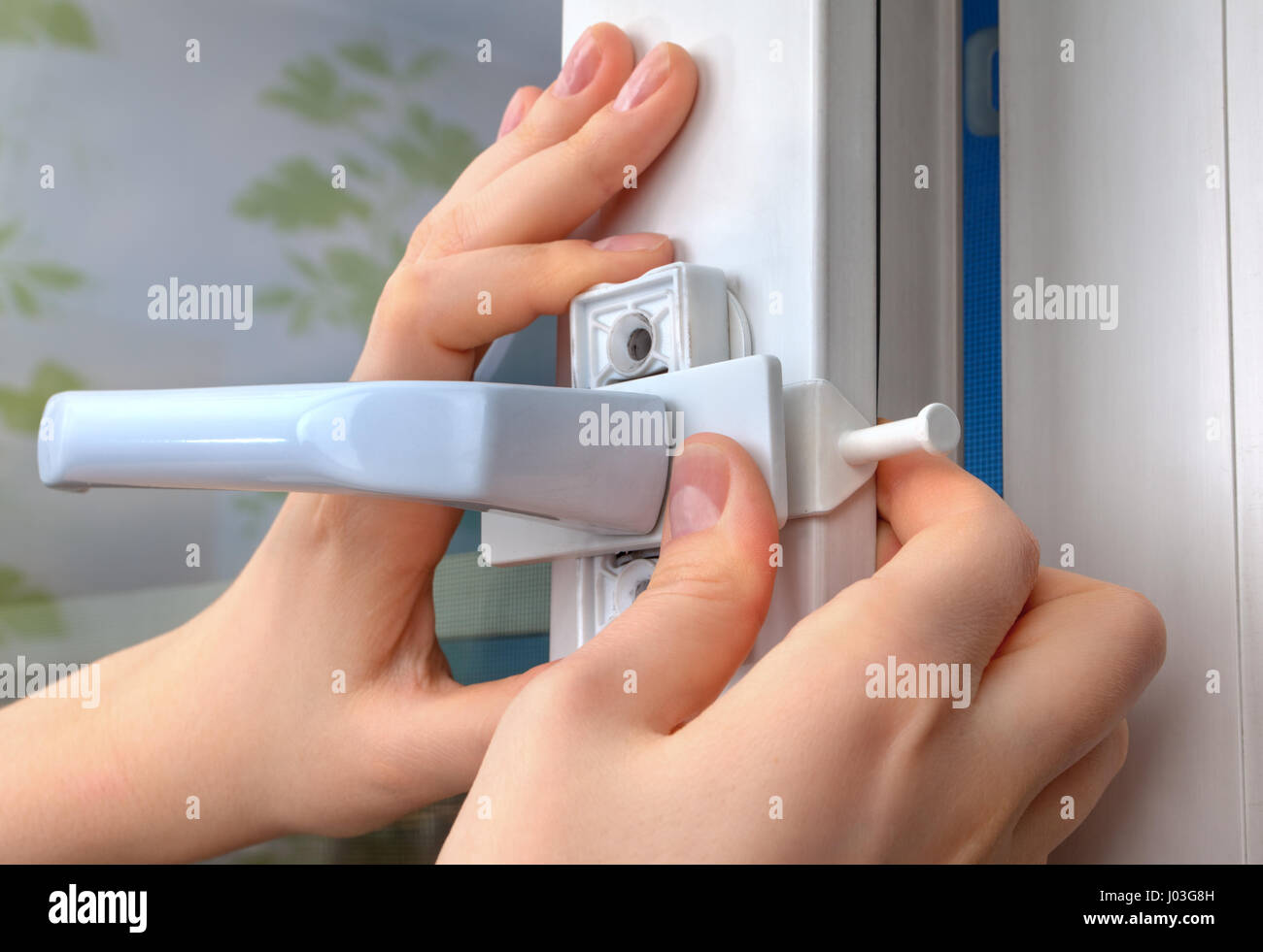 Installation of the window limiter for a plastic window, close-up Stock ...