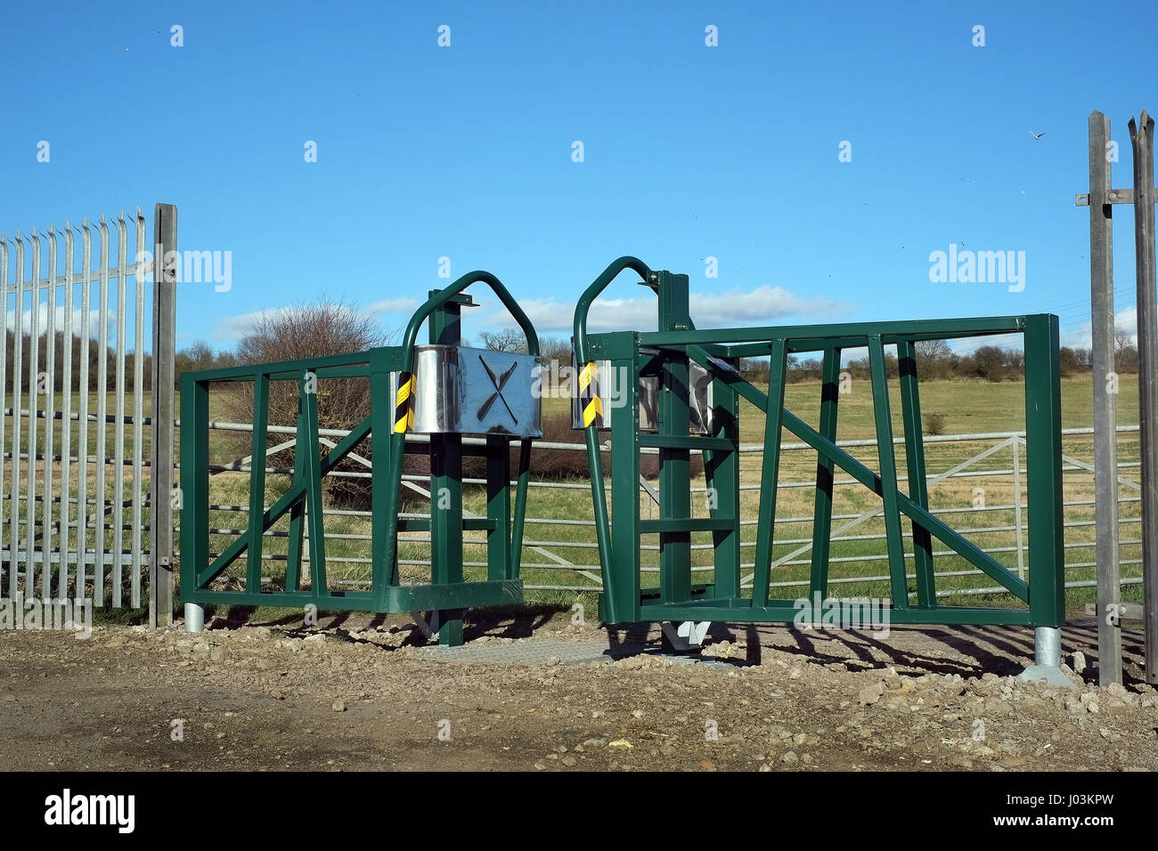 Modern access restriction steel safety gate on country path to prevent ...