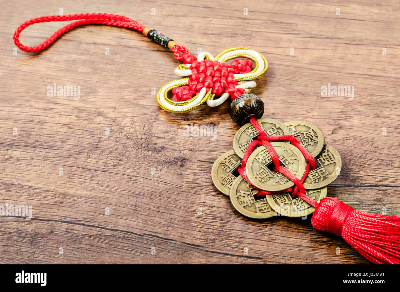 Chinese coins string hi-res stock photography and images - Alamy