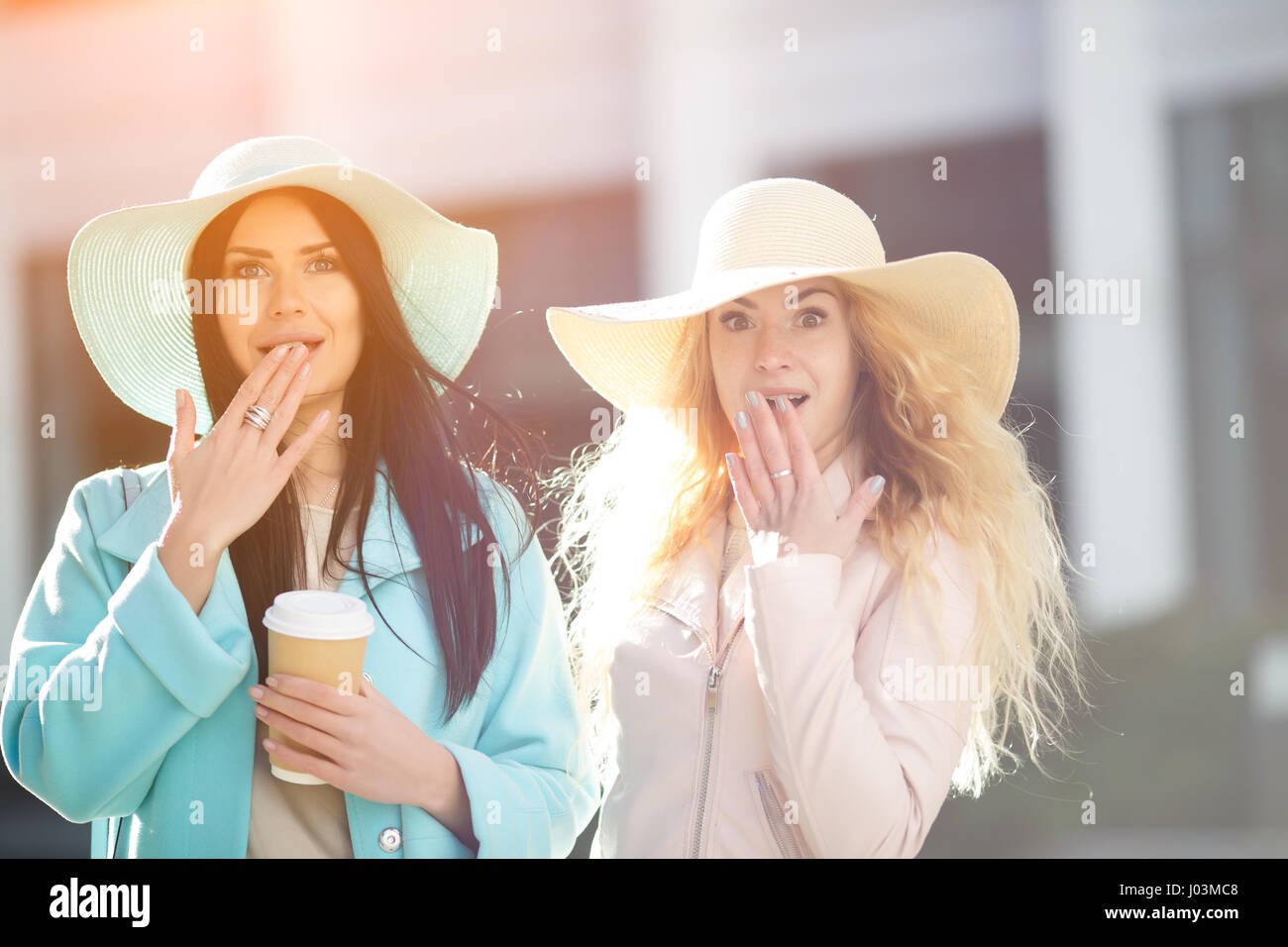 Two young girls near building Stock Photo - Alamy