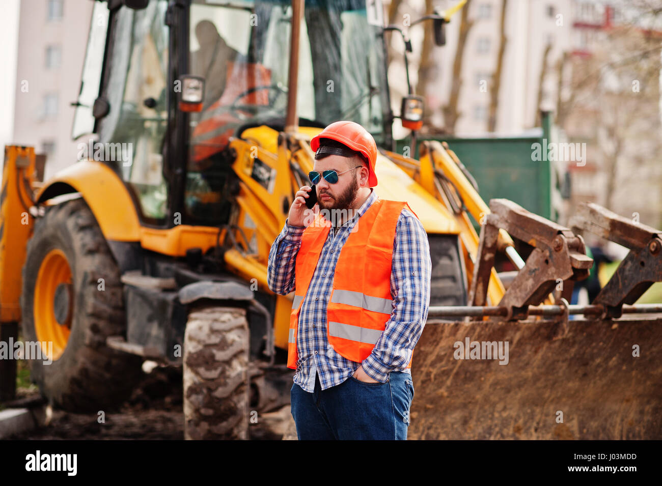 Brutal beard worker man suit construction worker in safety orange ...