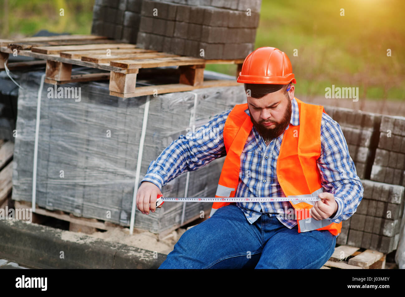 Brutal beard worker man suit construction worker in safety orange ...