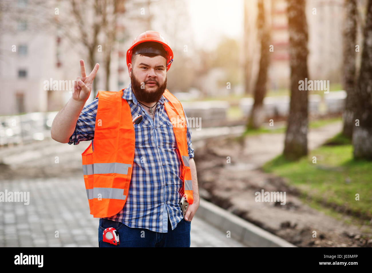 Portrait of brutal beard worker man suit construction worker in safety ...