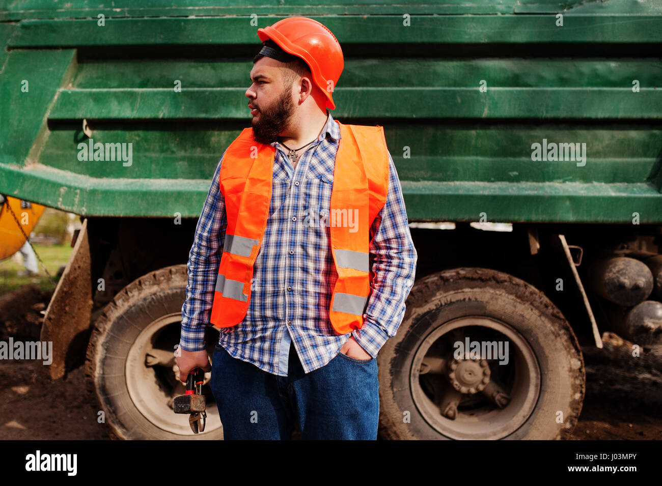 Brutal beard worker man suit construction worker in safety orange ...