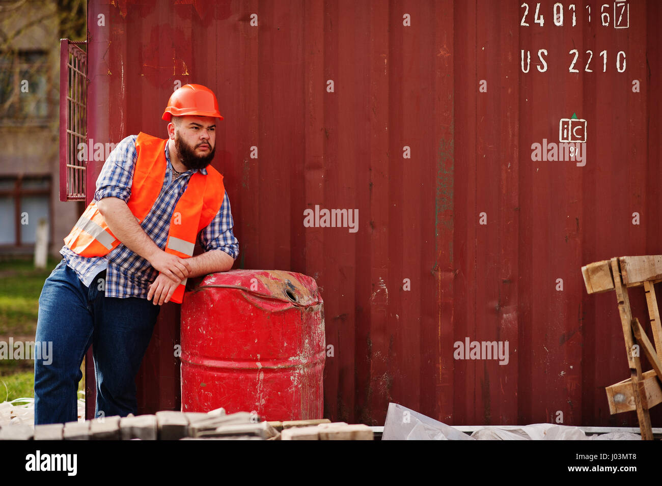 Brutal beard worker man suit construction worker in safety orange ...