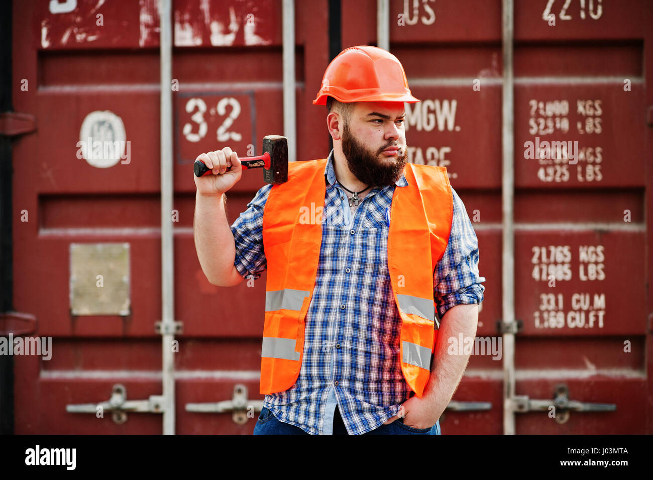 Brutal beard worker man suit construction worker in safety orange ...