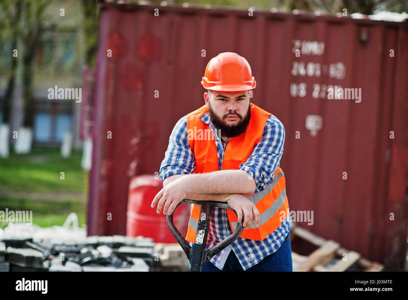 Brutal beard worker man suit construction worker in safety orange ...