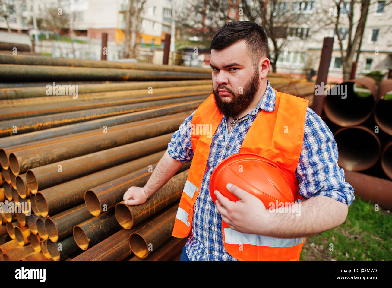 Brutal beard worker man suit construction worker in safety orange ...