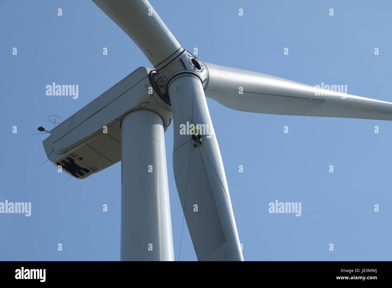 Windmill construction worker on the windmill Stock Photo - Alamy