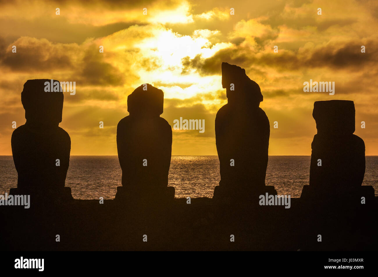 Moai statues at sunset Ahu Tahai site, on the coast of Easter Island ...