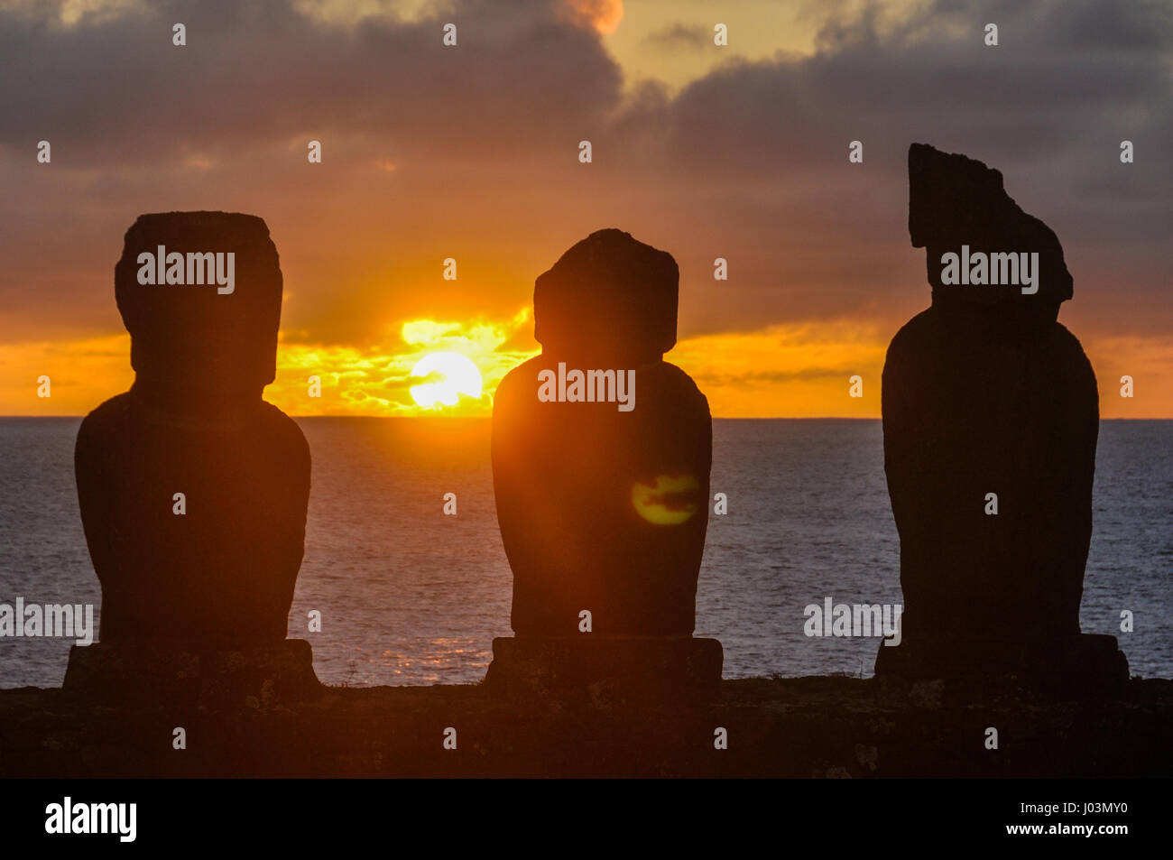 Moai statues at sunset Ahu Tahai site, on the coast of Easter Island ...