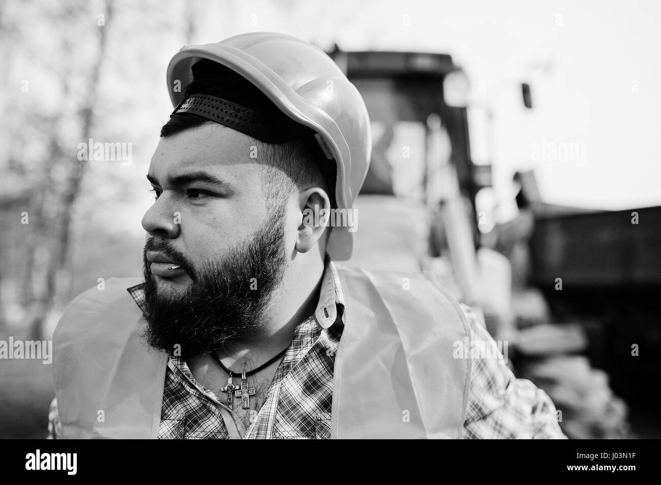 Close up portrait of brutal beard worker man suit construction worker ...