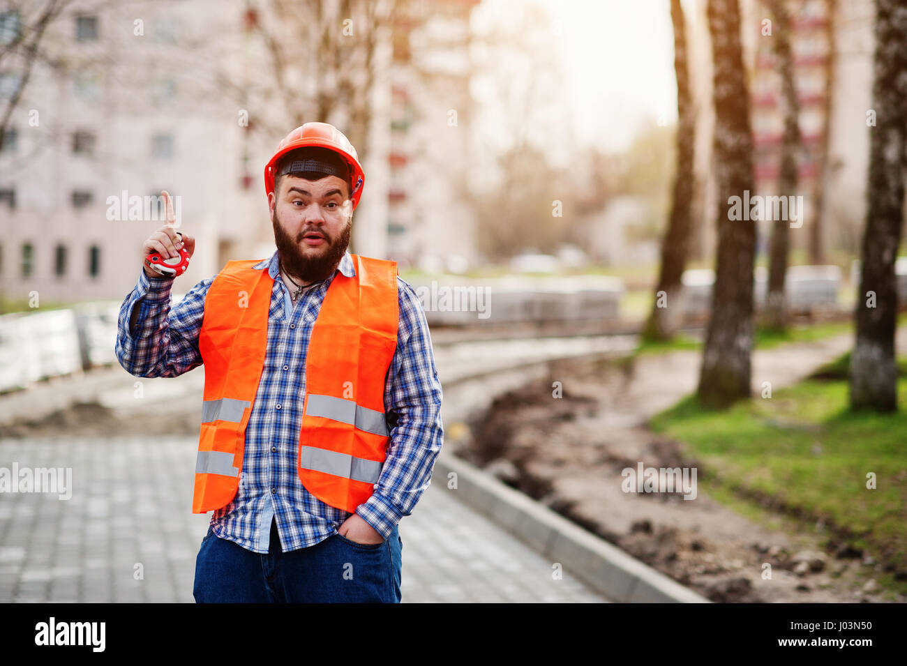 Portrait of brutal beard worker man suit construction worker in safety ...