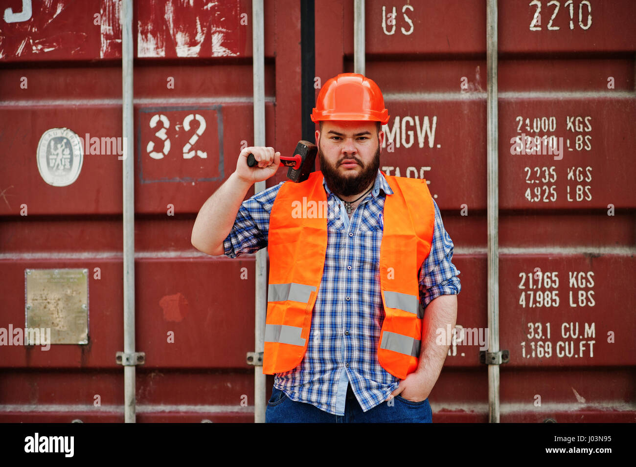 Brutal beard worker man suit construction worker in safety orange ...
