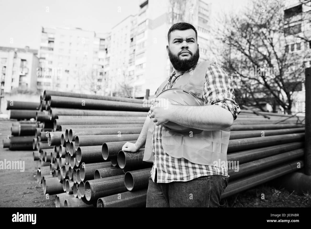 Worker in orange uniform Black and White Stock Photos & Images - Alamy