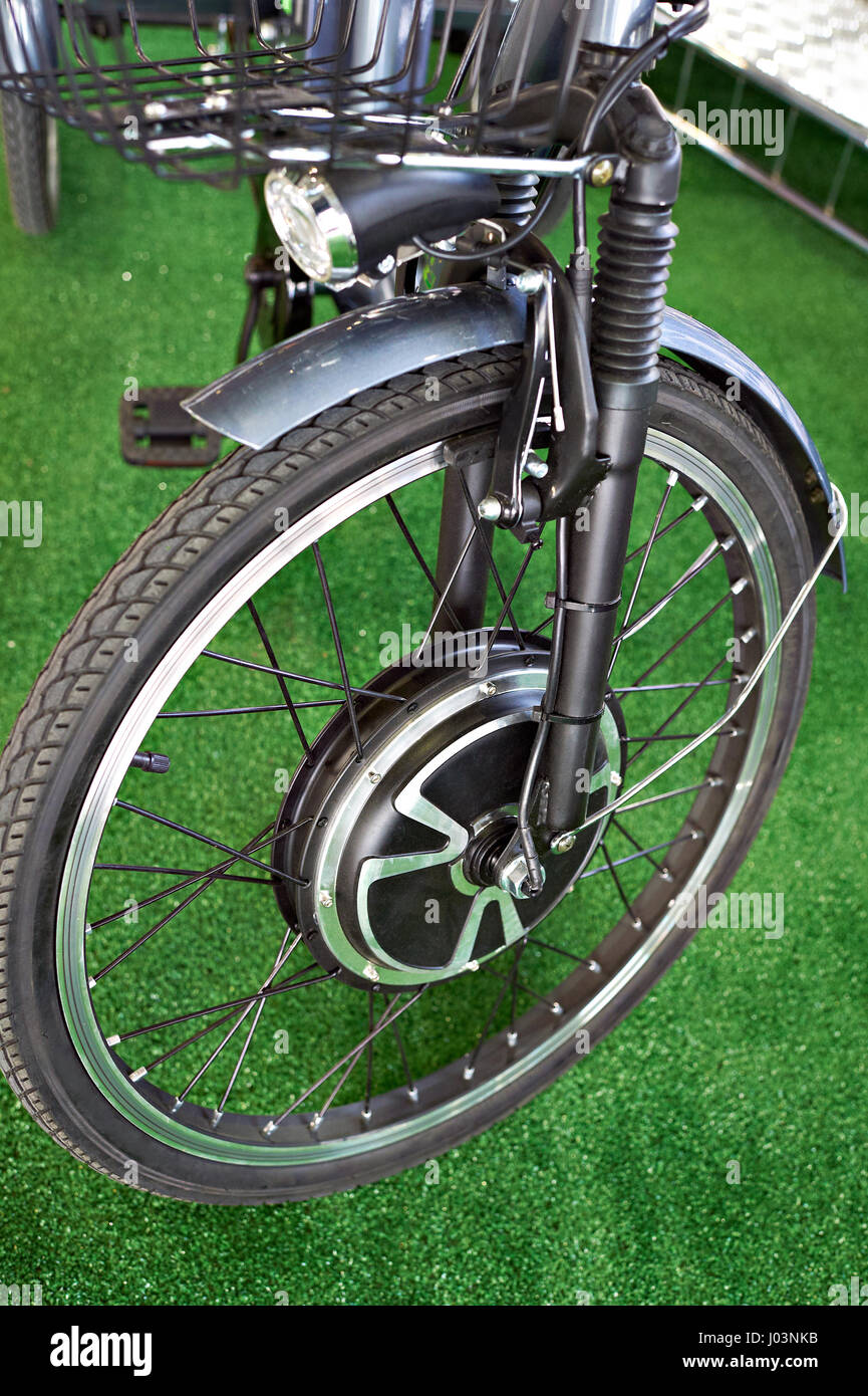 Front wheel electric bike with engine closeup Stock Photo - Alamy