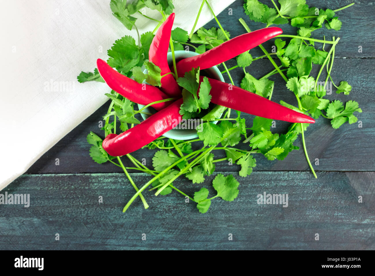 Peppers and cilantro leaves in colors of Mexican flag Stock Photo - Alamy