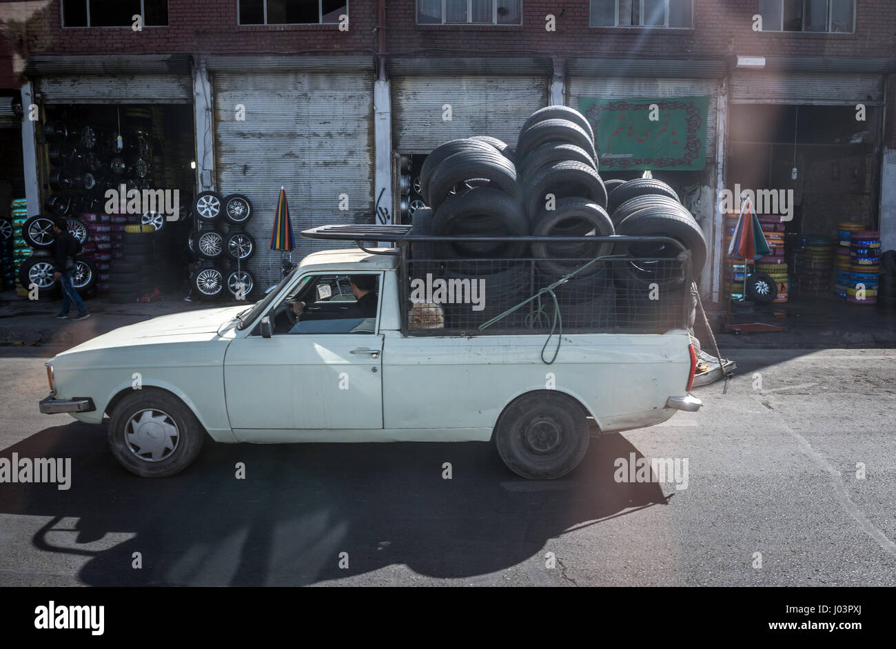 Pick up loaded with tires in Tehran city, capital of Iran and Tehran ...