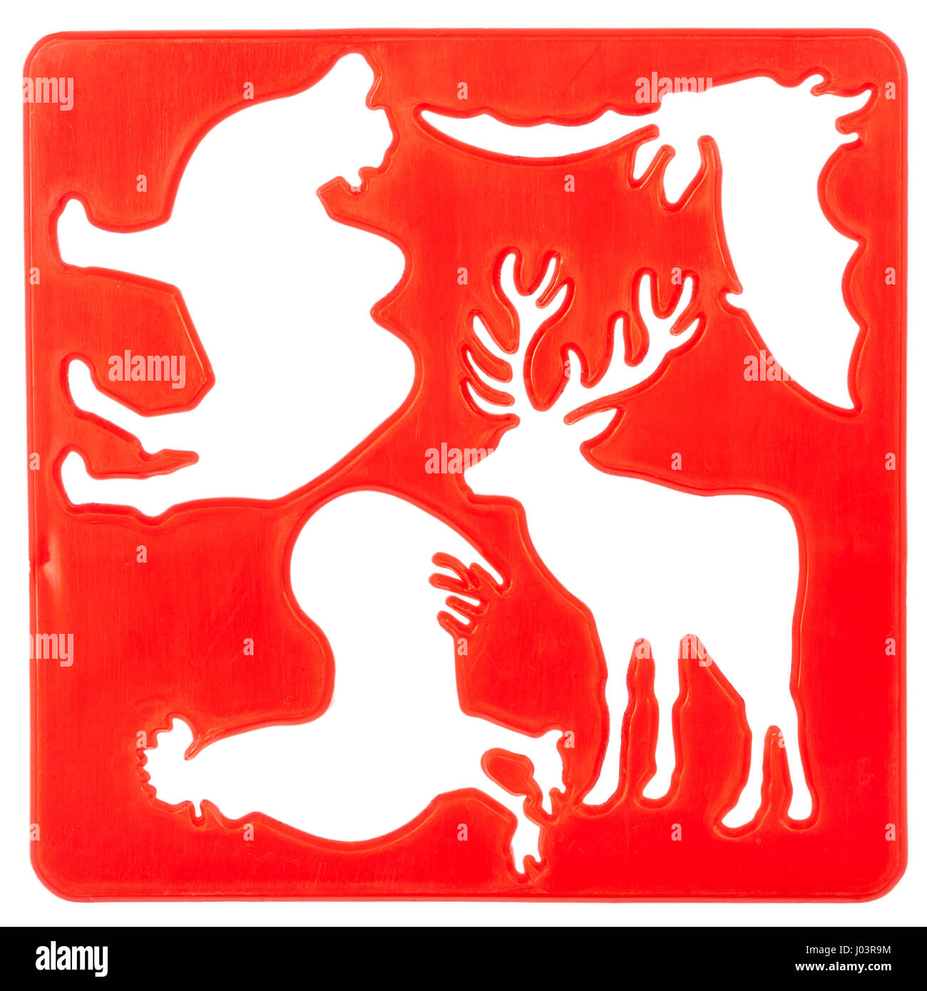 Old red plastic stencil isolated on white Stock Photo - Alamy