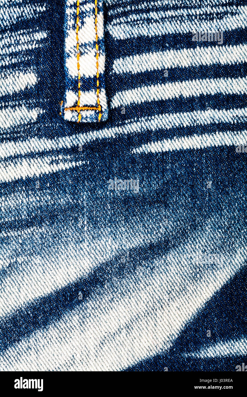 Worn striped denim jeans texture with strap Stock Photo - Alamy