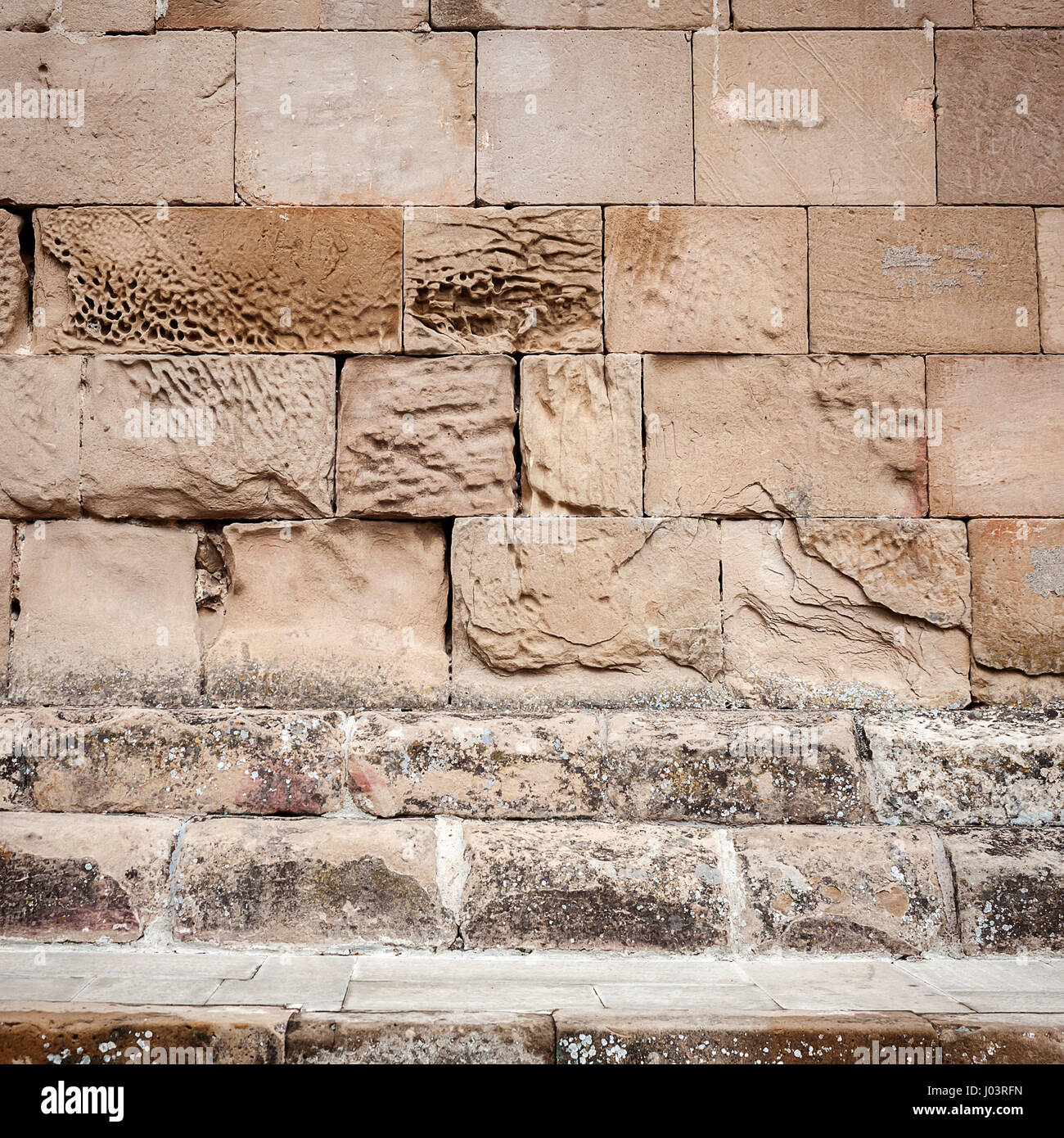 Wall of stones and pavement Stock Photo - Alamy