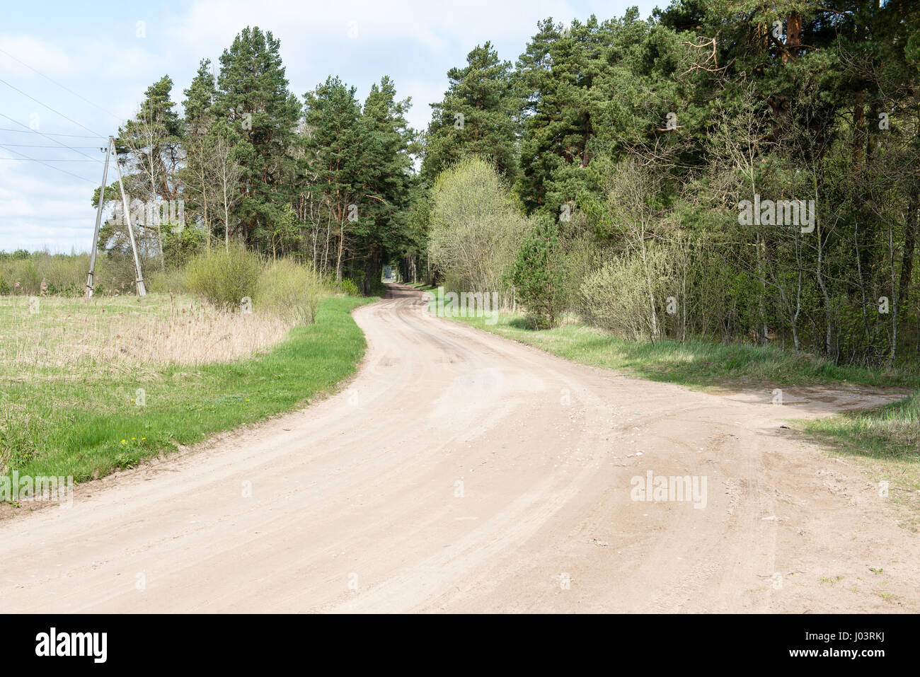 empty country road in spring with perspective and shadows Stock Photo ...