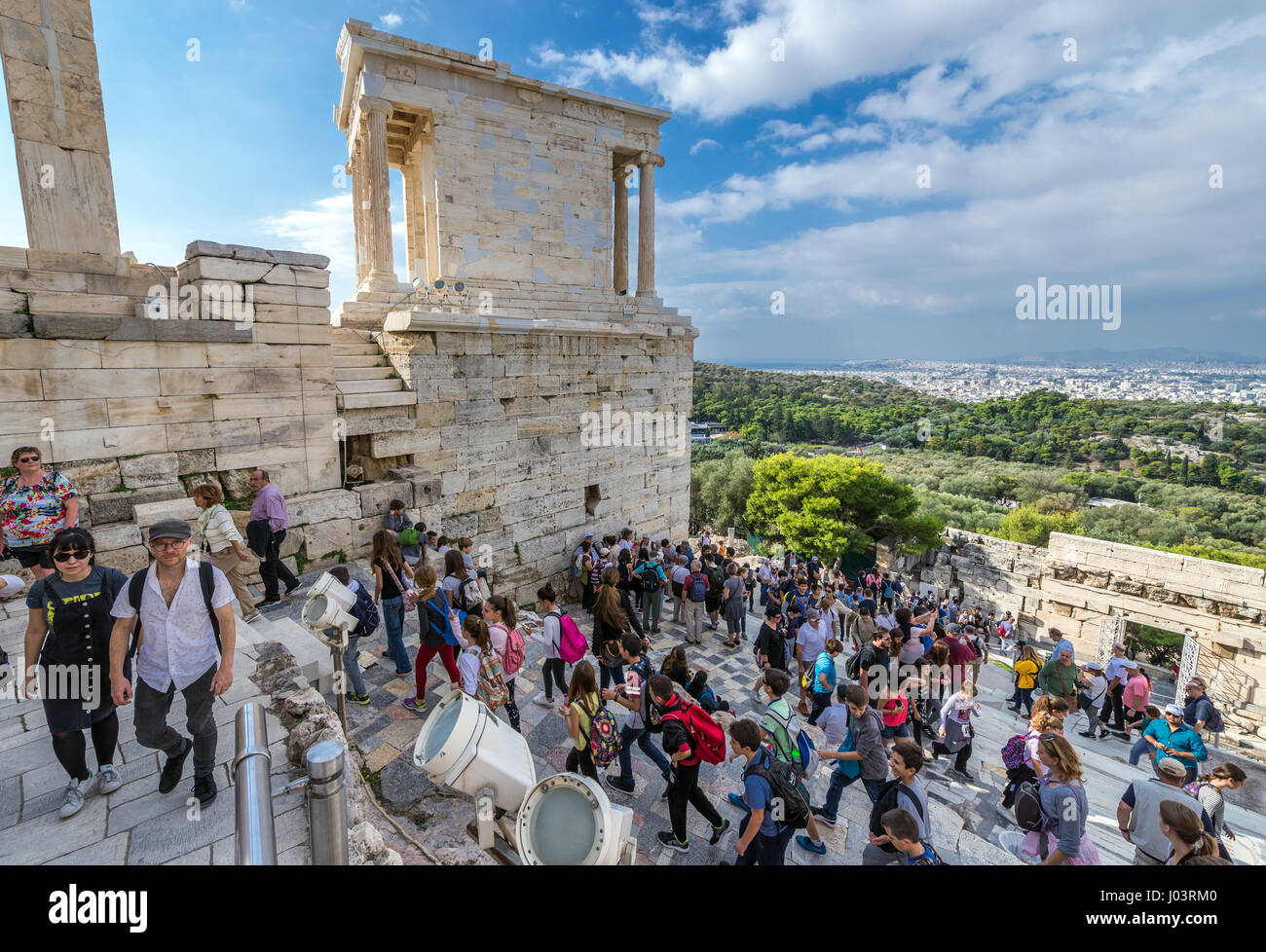 Tourists on a stairs in front of gateway called Propylaea, entrance to ...