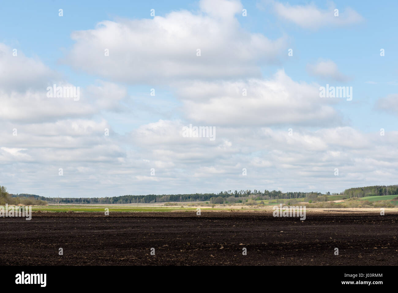 countryside fields in early spring with clouds and farmland Stock Photo ...