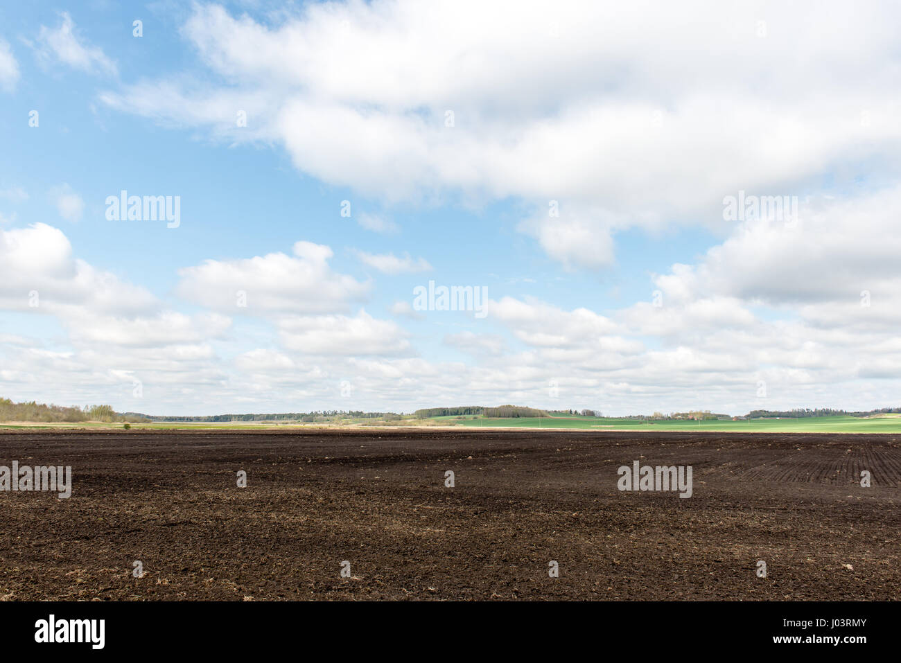 countryside fields in early spring with clouds and farmland Stock Photo ...