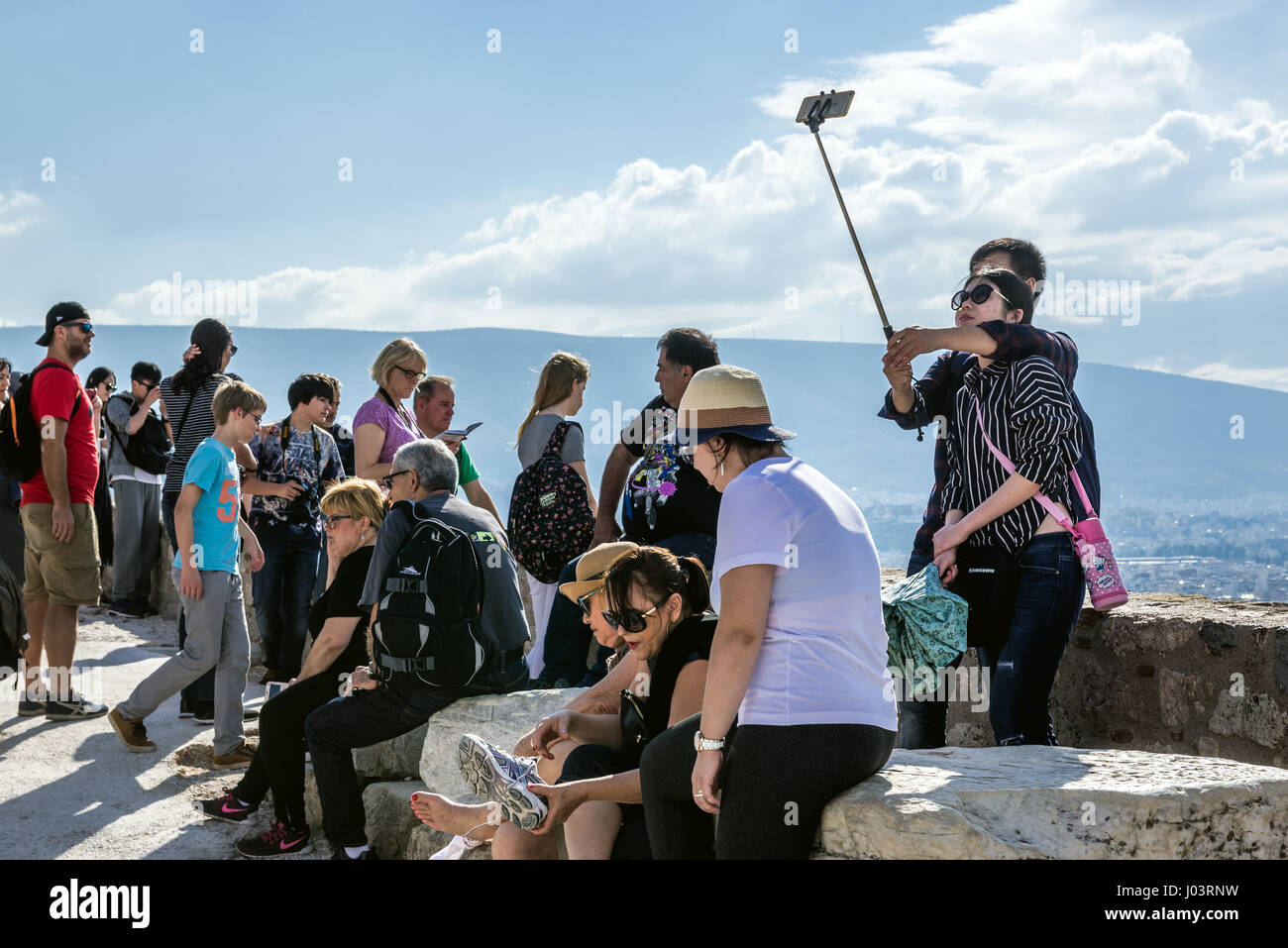 Tourists in front of Parthenon temple dedicated to the goddess Athena ...
