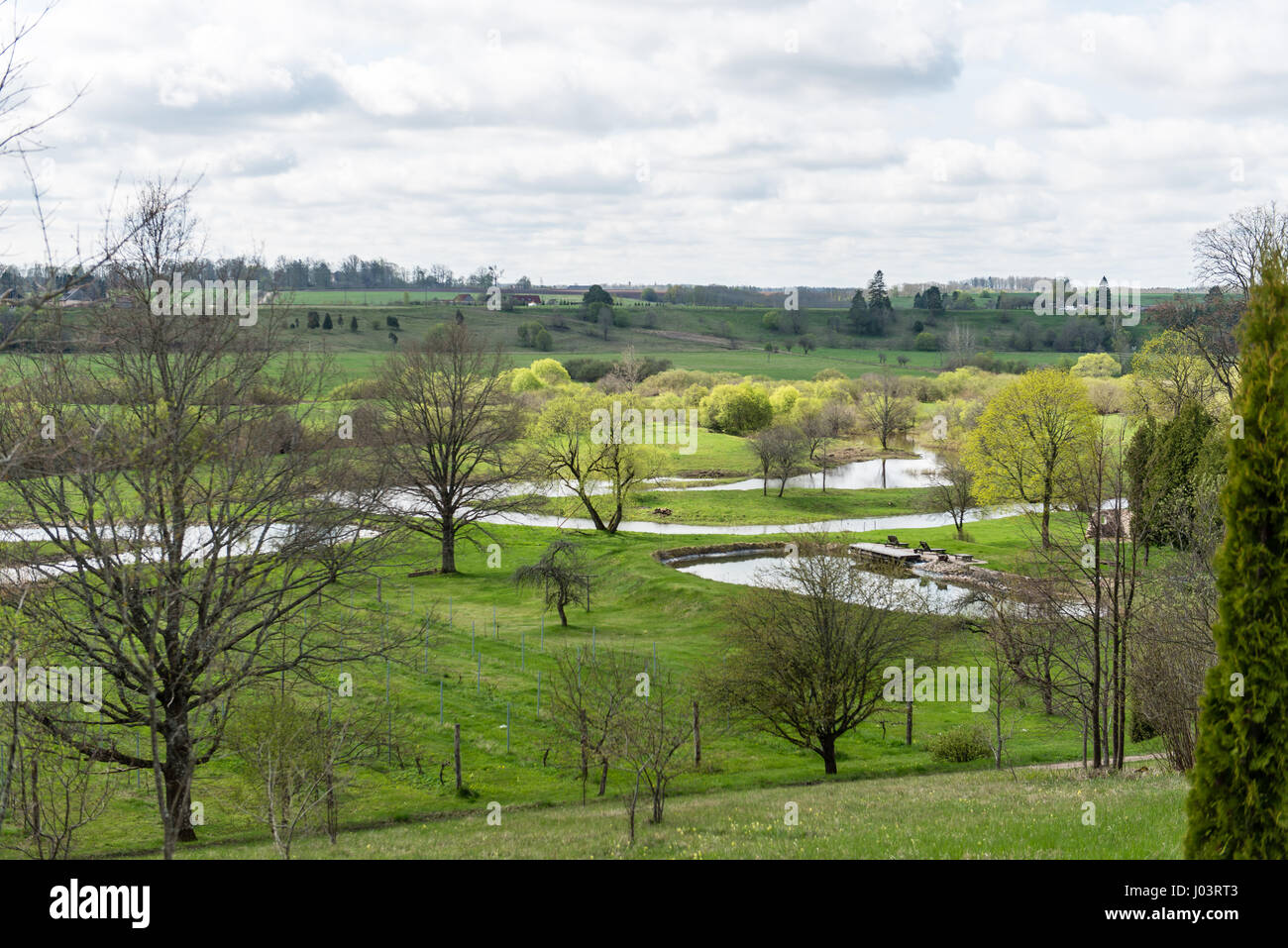 countryside fields in early spring with clouds and farmland Stock Photo ...
