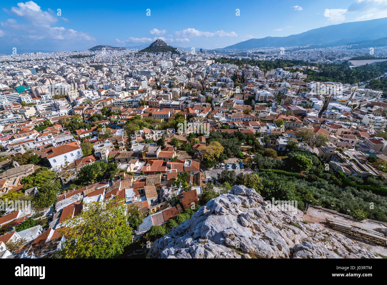 Aerial view from Acropolis of Athens city on Plaka historical district, Greece. Mount Lycabettus ...