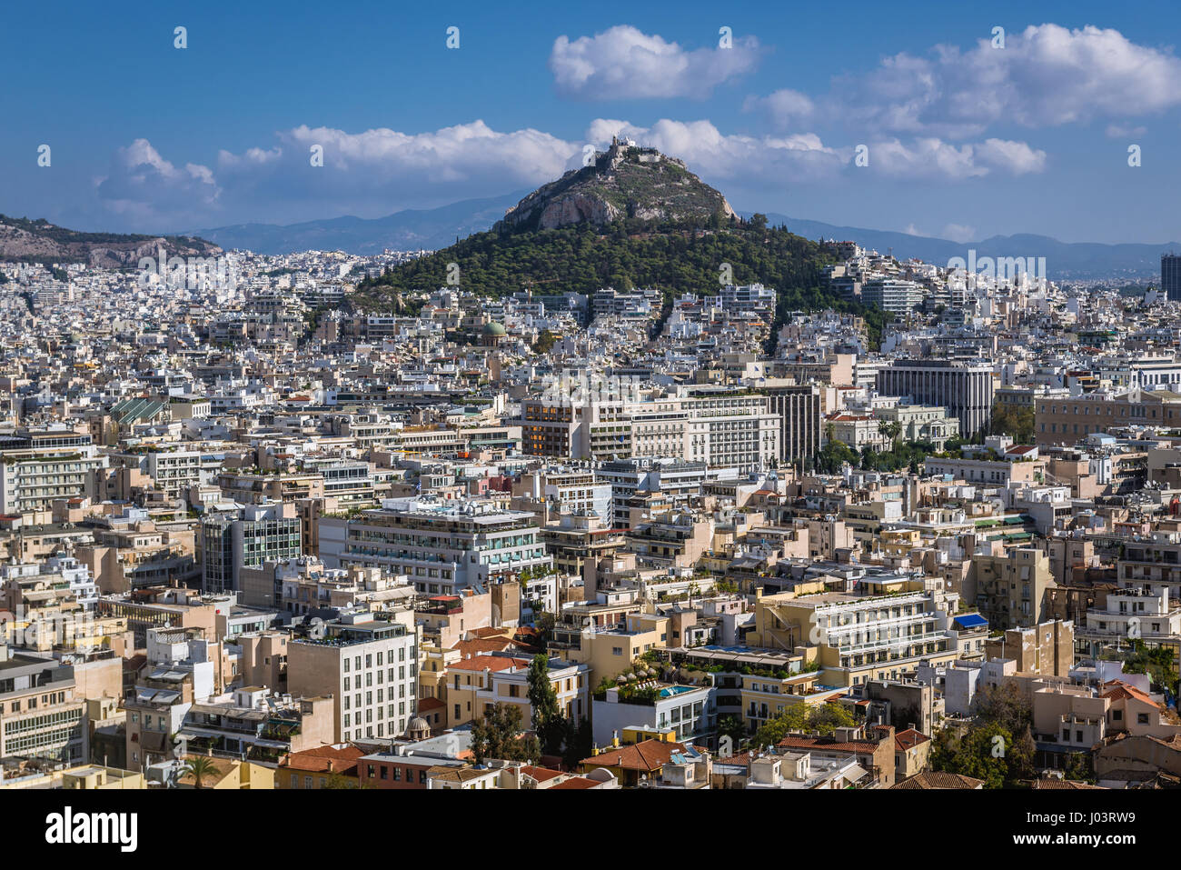Aerial view from Acropolis of Athens city, Greece. Mount Lycabettus with Church of St George ...