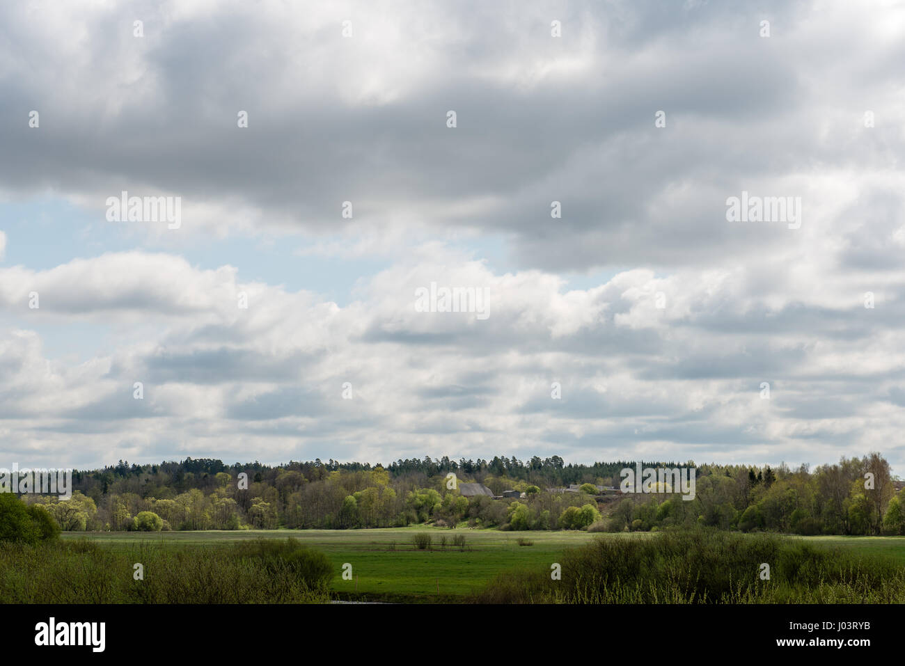 countryside fields in early spring with clouds and farmland Stock Photo ...