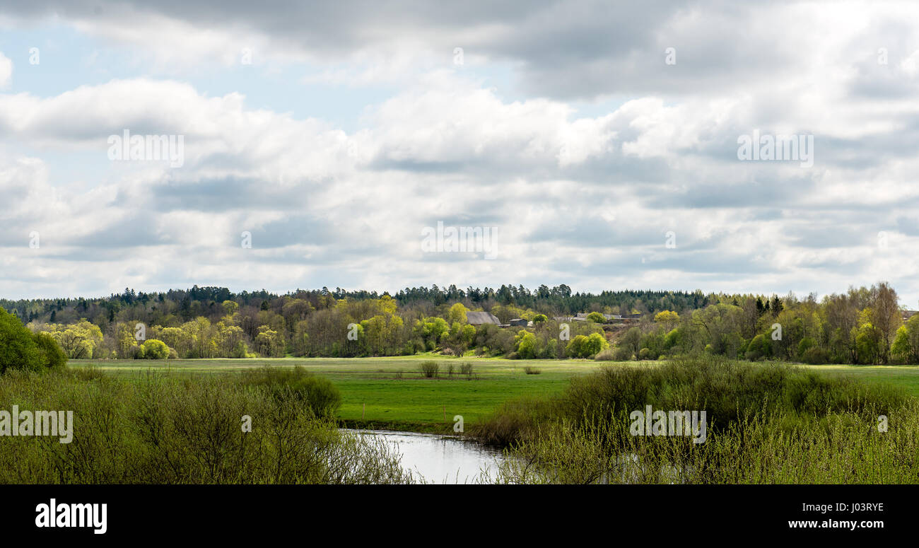 countryside fields in early spring with clouds and farmland Stock Photo ...