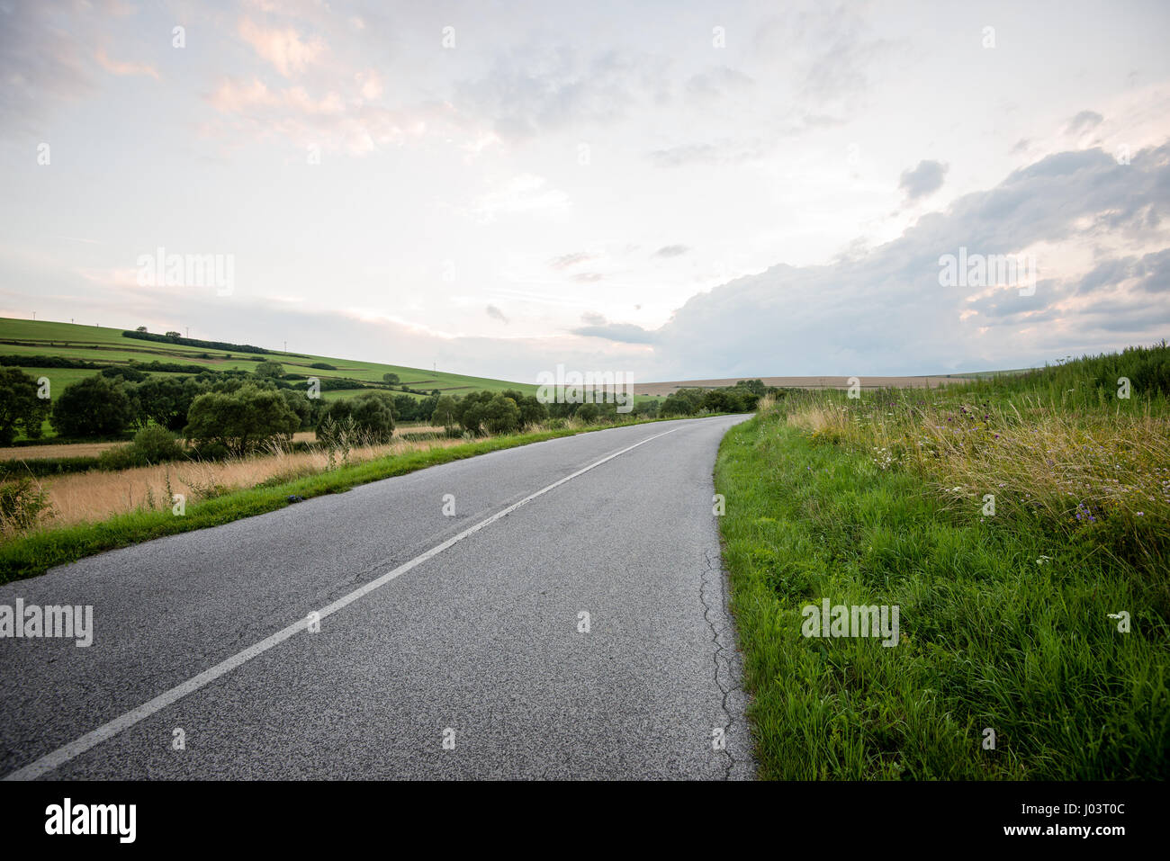 mountain country road in summer at countryside with trees around Stock ...