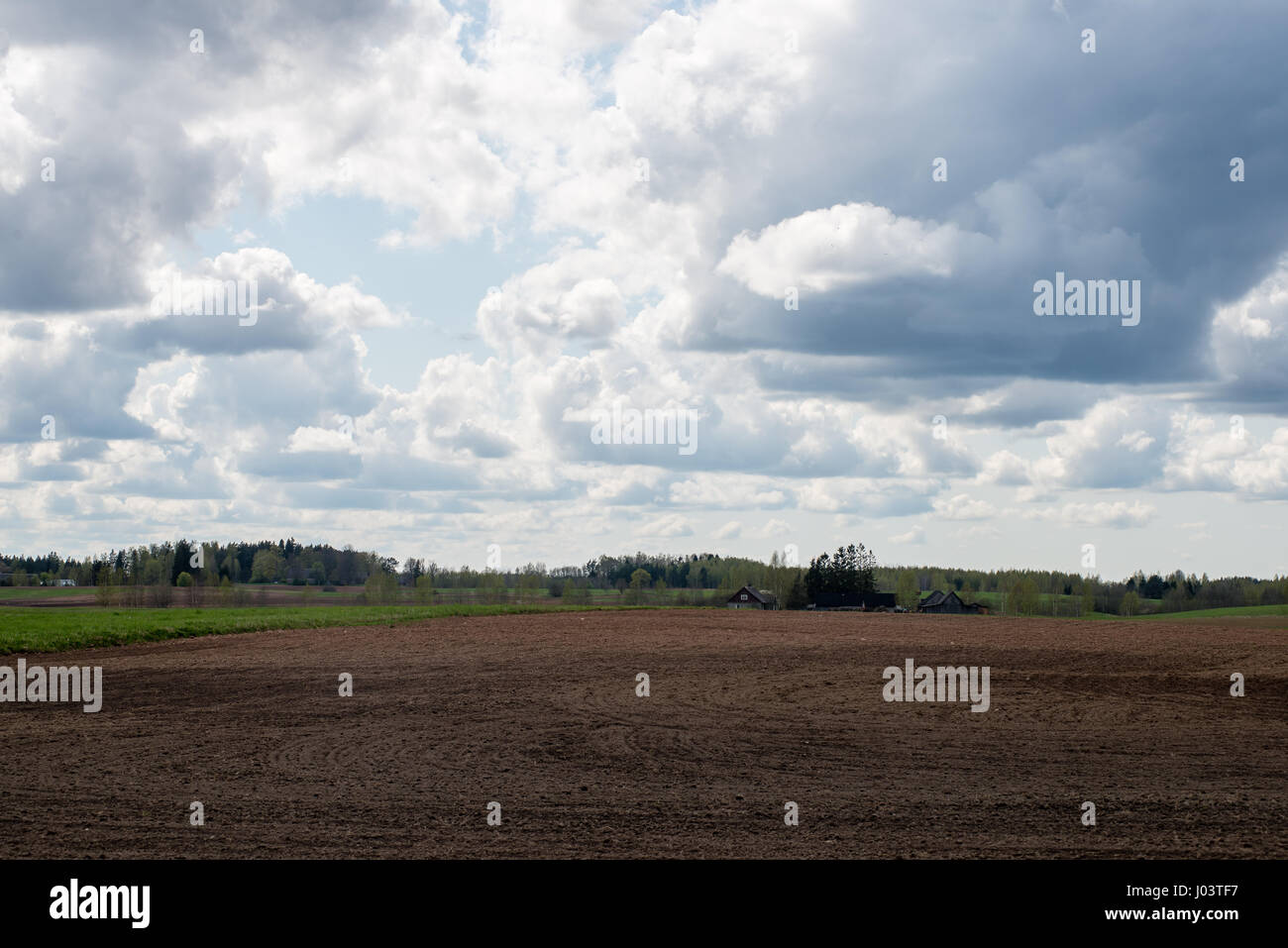 countryside fields in early spring with clouds and farmland Stock Photo ...