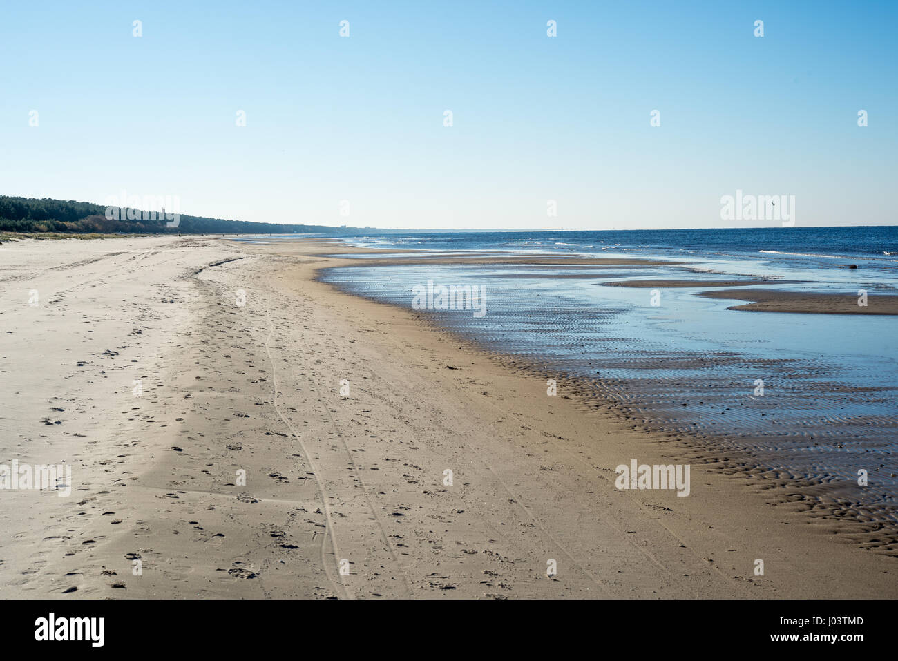 icy sea beach with first ice pieces in baltic sea. latvia Stock Photo ...