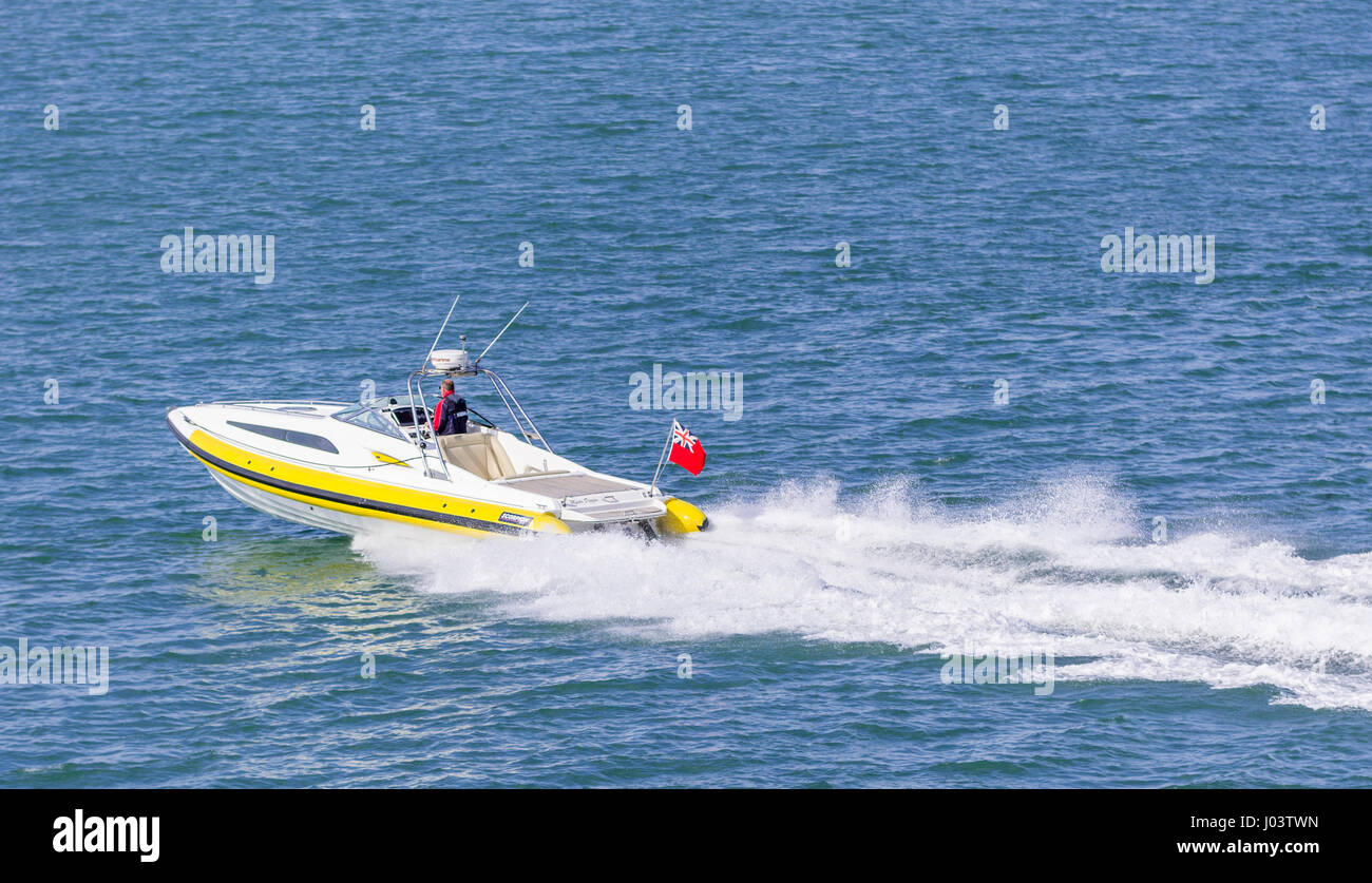 Small speed boat speeding along at sea, with one male driver Stock ...