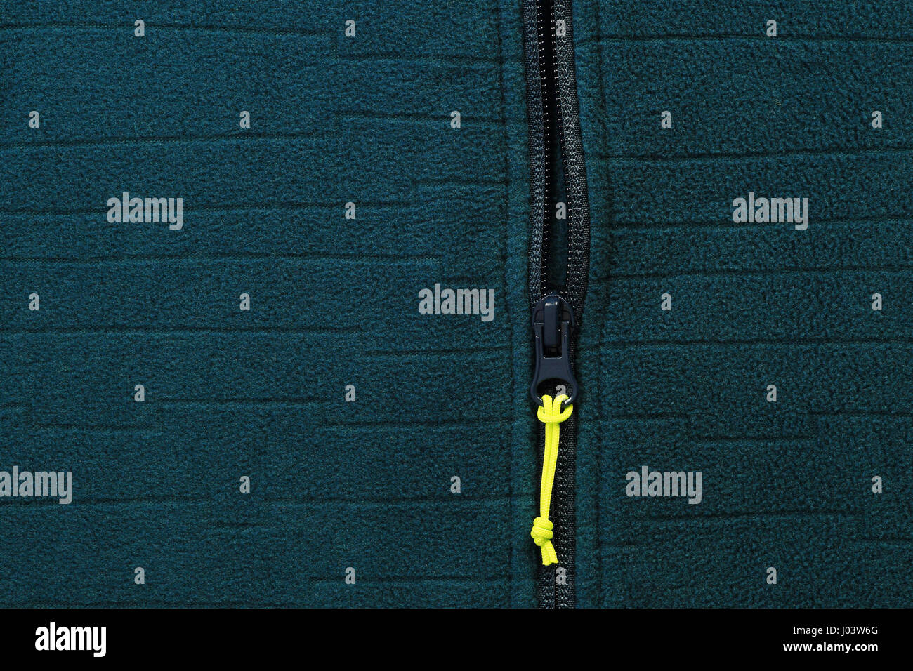 Jacket with zipper close-up. Green textile background. New jacket ...