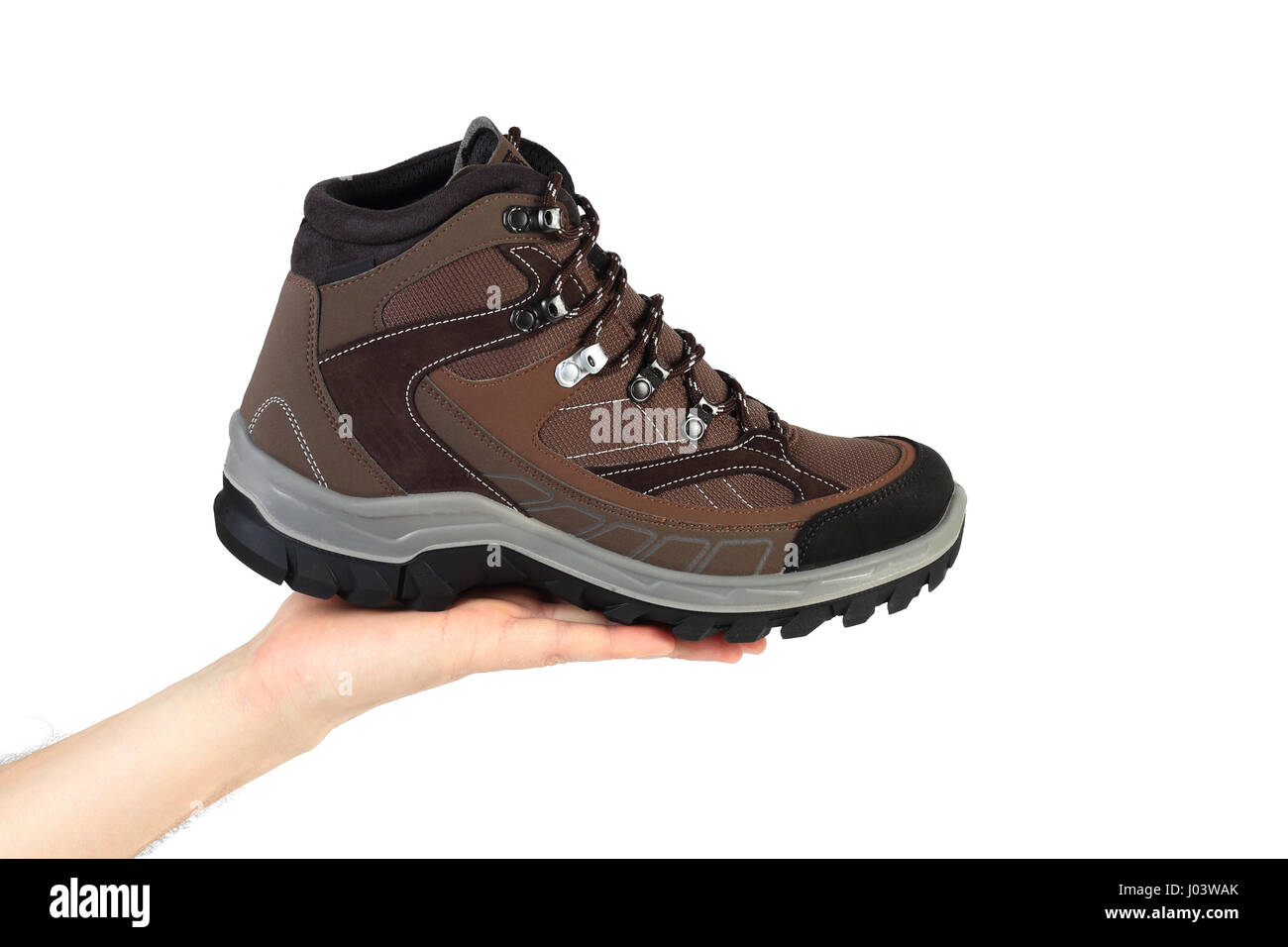 New shoes on hand isolated on white background. Hand holding shoes ...