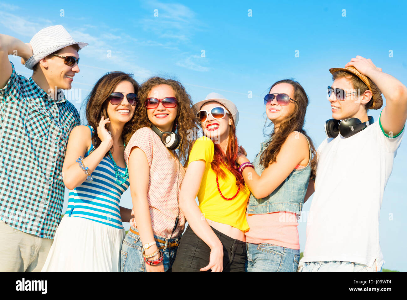 group of young people wearing sunglasses and hat Stock Photo - Alamy