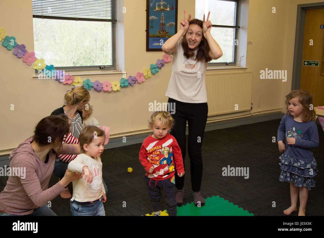 Playing games at a local playgroup Stock Photo - Alamy