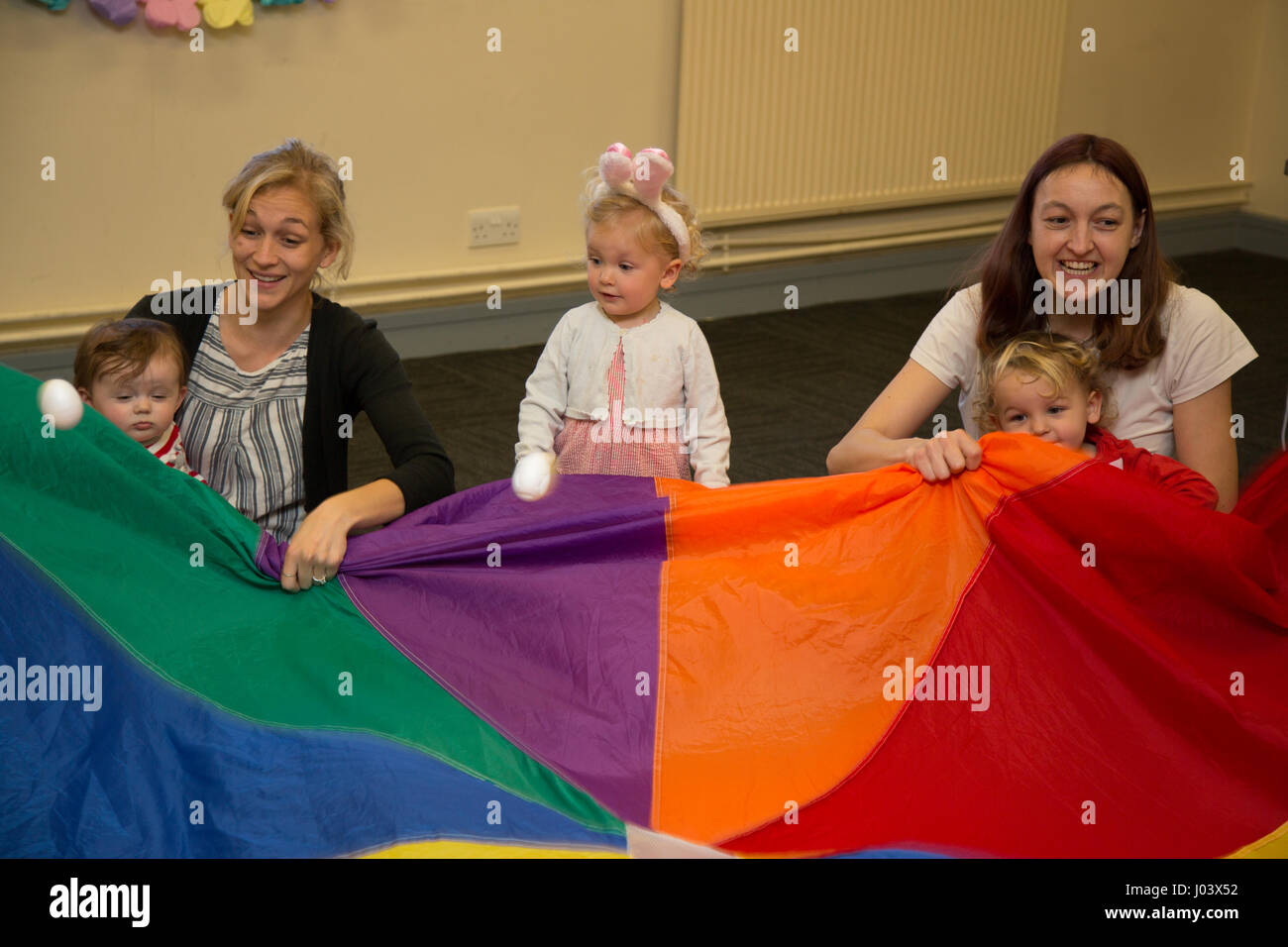 Children playing parachute hi-res stock photography and images - Alamy
