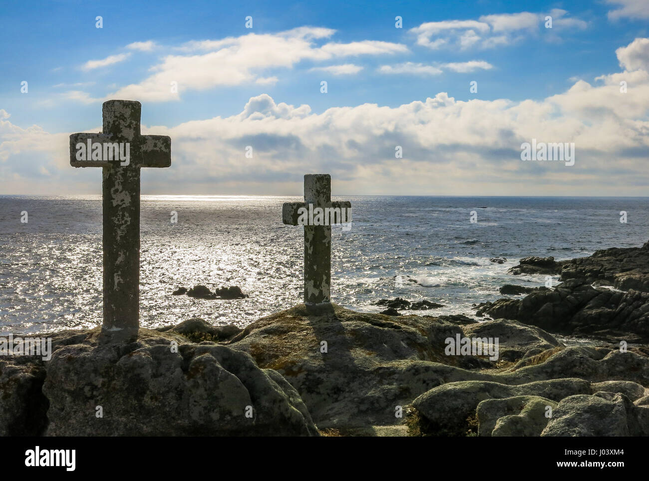 Stone cross monuments by the sea in late afternoon, Costa da Morte ...