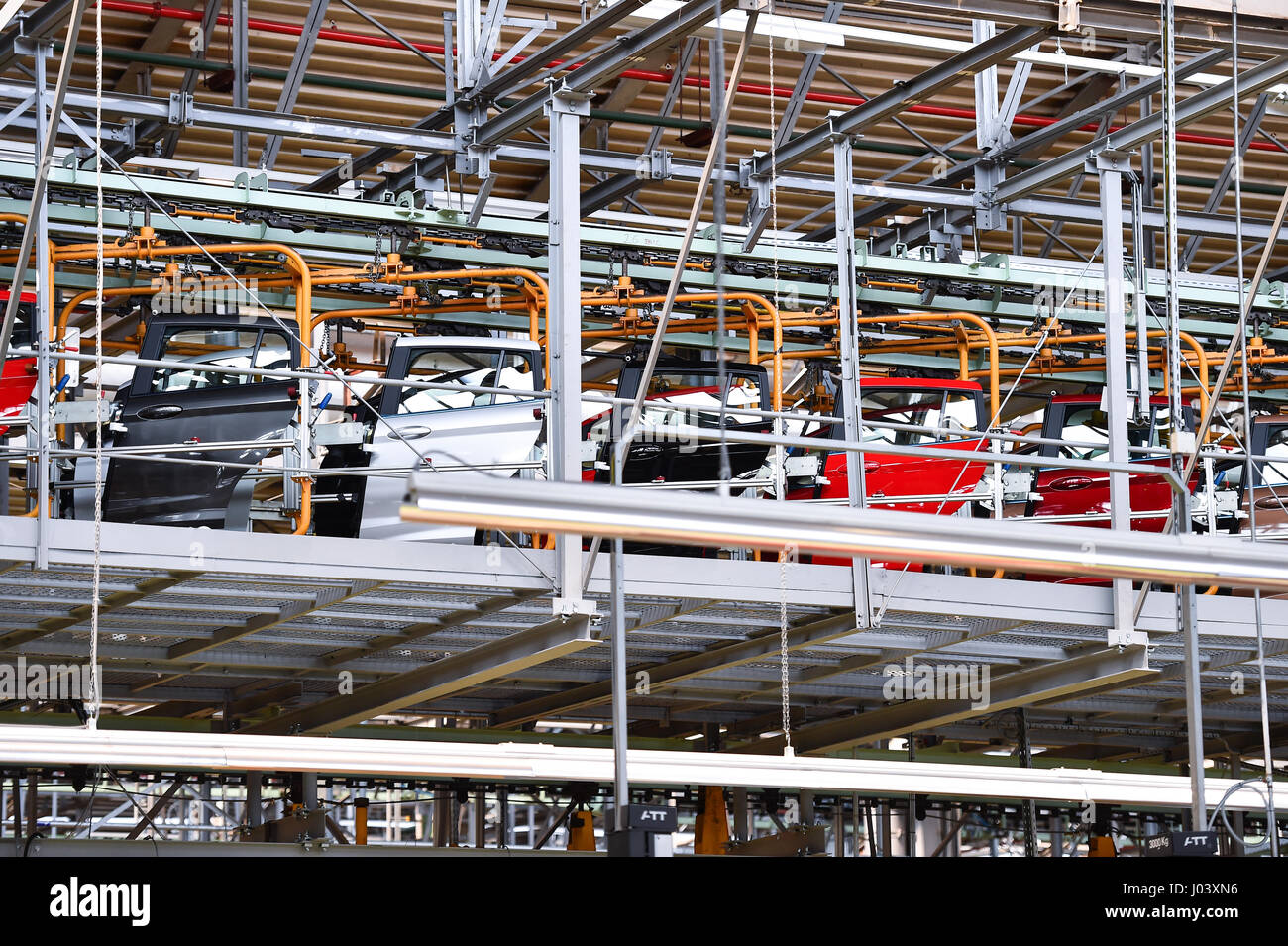 Car bodies on the production line inside automobile factory Stock Photo ...