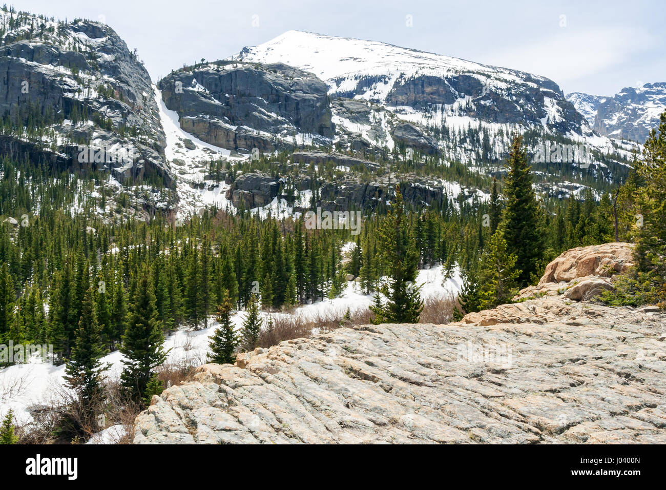 Overlook in the Colorado Rocky Mountains with a wide background of snow ...