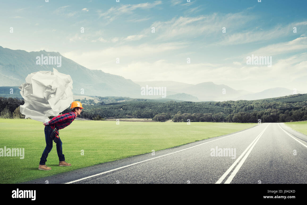 Engineer man carry load Stock Photo - Alamy